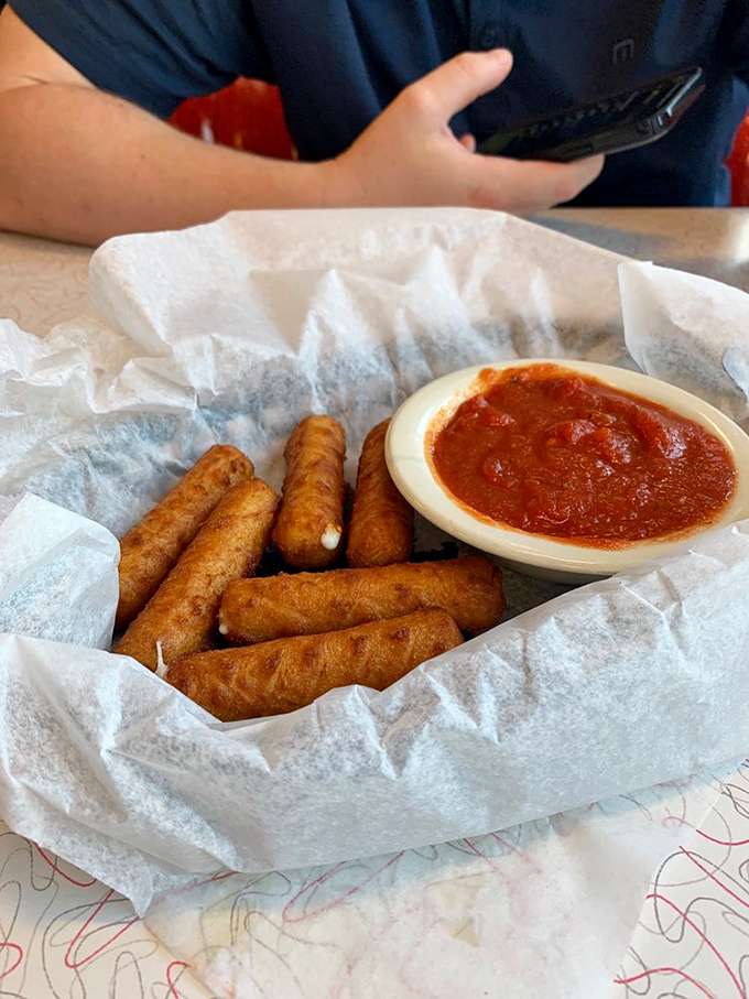 Golden cheese sticks arrive hot and stretchy, proving that some comfort foods never go out of style.