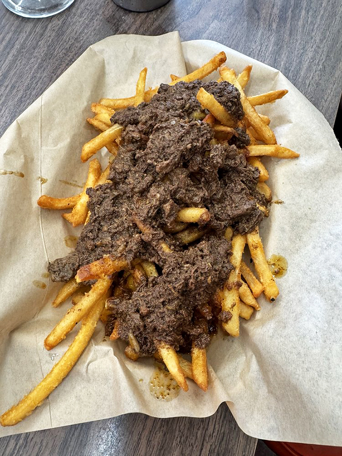 Chili fries that laugh in the face of utensils—a glorious avalanche of beefy goodness that transforms ordinary fries into something worth driving across town for.