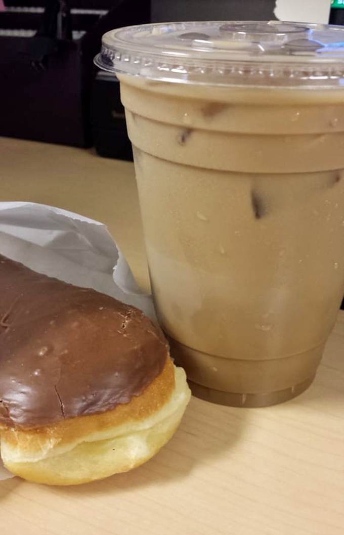 The classic pairing: a chocolate-glazed donut and iced coffee—partners in crime against morning grumpiness since forever.