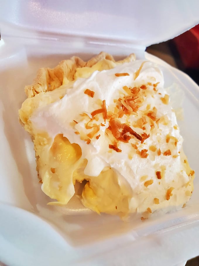 Coconut cream pie so perfect it could end family feuds. That toasted coconut sprinkle on top isn't decoration—it's the crown jewel.