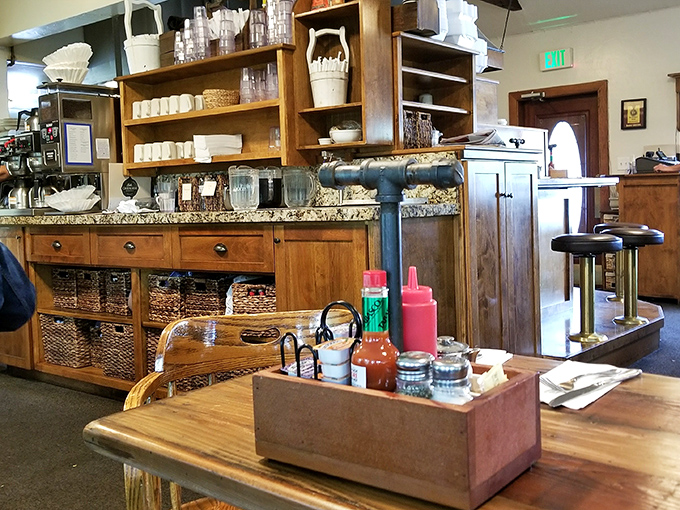 The condiment caddy—humble wooden vessel holding the essential breakfast accessories. Hot sauce diplomacy at its finest.