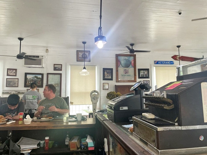The counter where magic happens—simple ingredients transformed into legendary dishes while regulars perch on stools, trading tales.