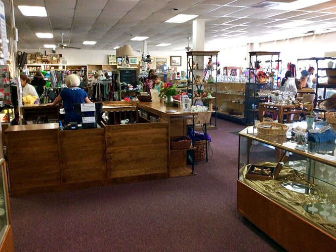 Friendly volunteers staff the wooden checkout counter, surrounded by display cases of smaller treasures and vintage collectibles.