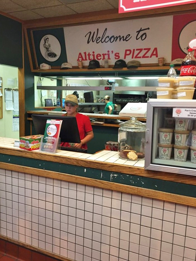 The heart of any great pizzeria – where orders become edible dreams and hungry customers become lifelong devotees.