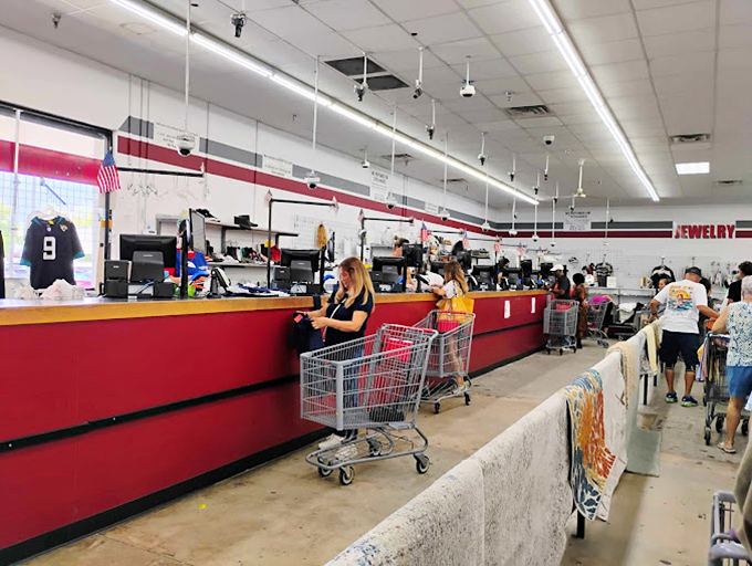 The checkout line: where $25 cart-filling dreams become reality. The red counter marks the finish line of this treasure hunt.