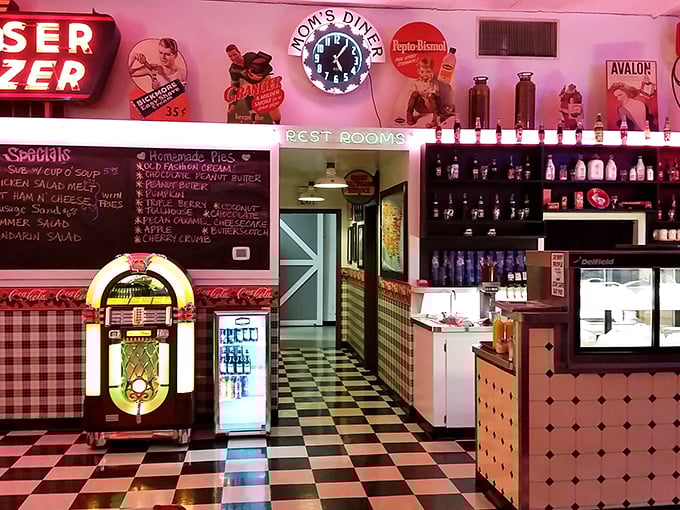 The counter view—where magic happens behind glass blocks and neon. Half diner, half museum of American food culture.