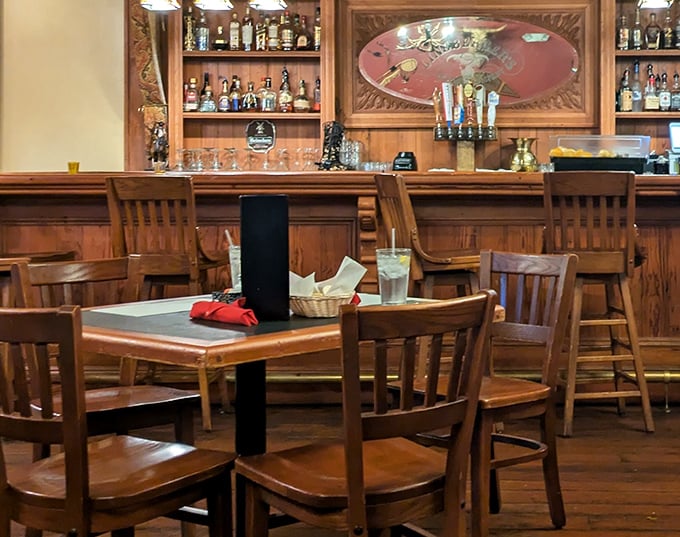 The bar area – where strangers become friends over bourbon discussions and the shared understanding that good steak is worth traveling for.