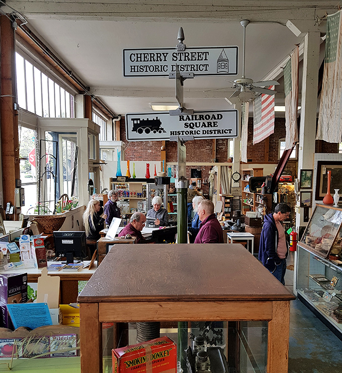 The Railroad Square Historic District sign reminds shoppers they're not just buying antiques—they're participating in preserving local history.