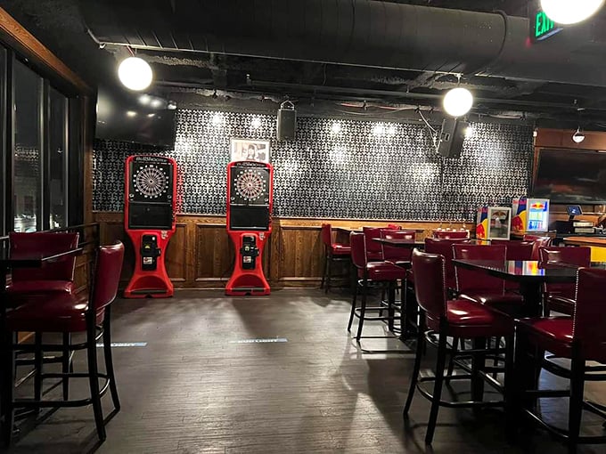 Electronic dart boards stand ready for friendly competition – because nothing settles a debate about the best burger topping like a game of 301.