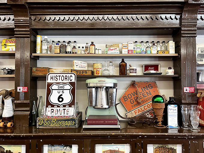 Vintage decorations aren't just props here – they're genuine pieces of soda fountain history.
