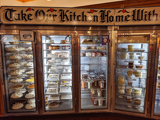 "Take Our Kitch'n Home With You" isn't just a sign—it's permission to extend your indulgence. Those display cases are basically a museum of butter.