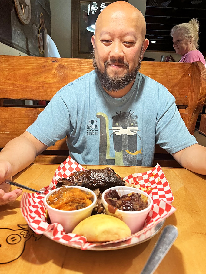That moment when you're about to dive into barbecue nirvana. The smile says it all—resistance is futile.