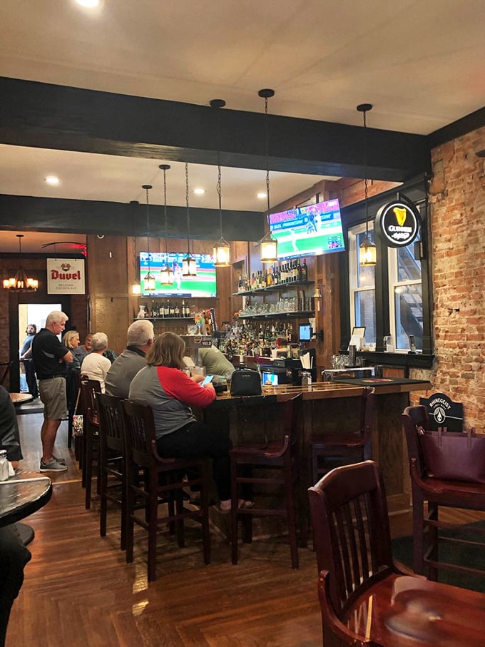The bar area buzzes with locals who've discovered what visitors drive miles to experience—community served alongside excellent drinks.