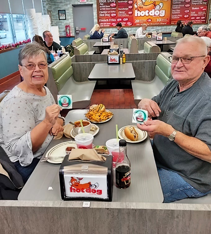 Local wisdom being shared over hot dogs and fries – this is how community knowledge gets passed down.