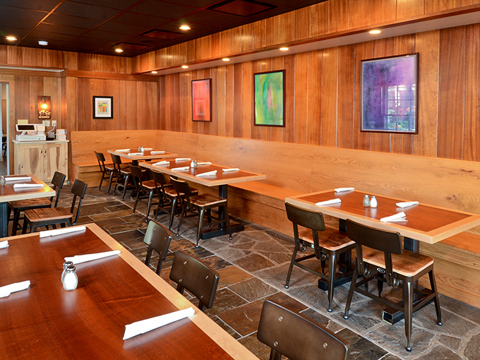 Clean lines, wooden bench seating, and just enough space between tables to keep your "mmm" sounds from disturbing neighboring BBQ enthusiasts.