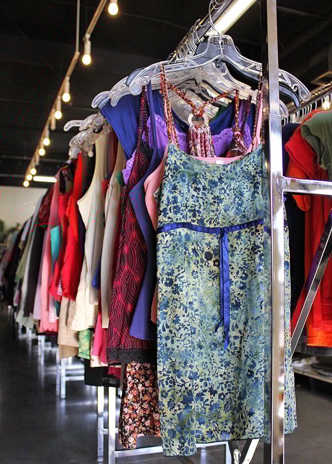 A rainbow of fashion possibilities hanging in perfect formation – each dress a character waiting for its starring role.