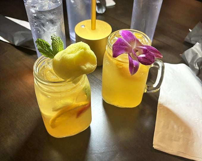 These drinks aren't just beverages—they're tropical vacations in glassware, complete with their own flower leis.