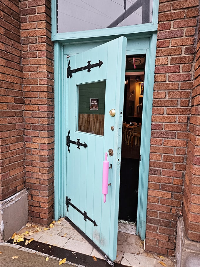 The turquoise door with black hardware isn't just an entrance—it's an invitation to step into a world where calories don't count.