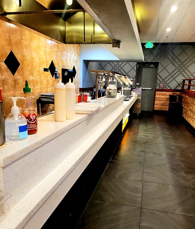 Behind every great buffet is a spotless prep area. This kitchen counter gleams with the promise of culinary adventures yet to come.