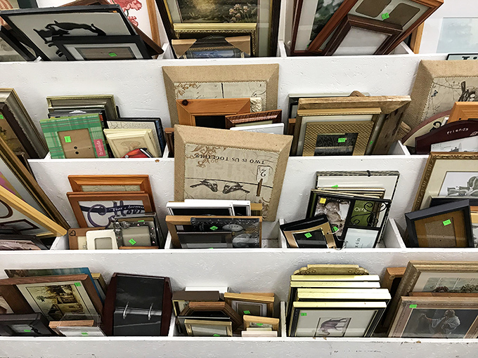 A gallery of empty frames, each one a window of possibility waiting for your family photos or flea market art finds.