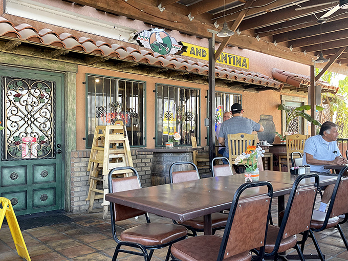 The outdoor patio with its wrought iron details and terracotta tiles doesn't just offer fresh air—it offers a slice of California-meets-Mexico ambiance.