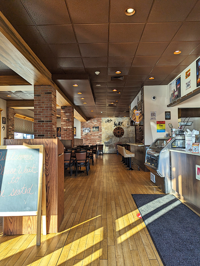 Wooden booths, brick columns, and the promise of smoky delights – a barbecue trinity that never disappoints.