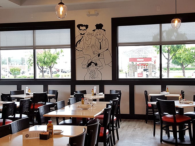 Clean lines, comfortable seating, and those playful wall illustrations—the perfect stage for the serious business of sandwich consumption.