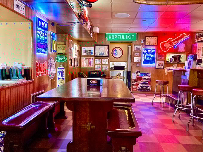 Neon signs cast their glow over wooden tables where countless elbows have rested, creating that perfect "third place" between home and work.