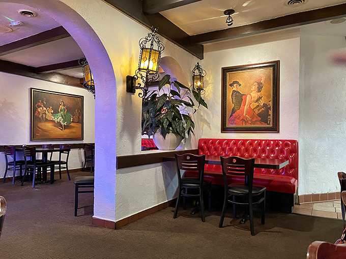 Wrought iron lanterns cast a warm glow over red booths and Mexican artwork—transporting you south of the border without leaving Michigan.