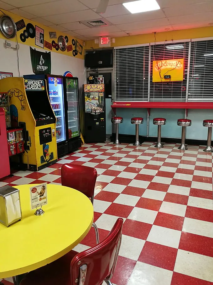 An arcade game and diner stools – because nothing pairs with hot dogs like nostalgia and Pac-Man.
