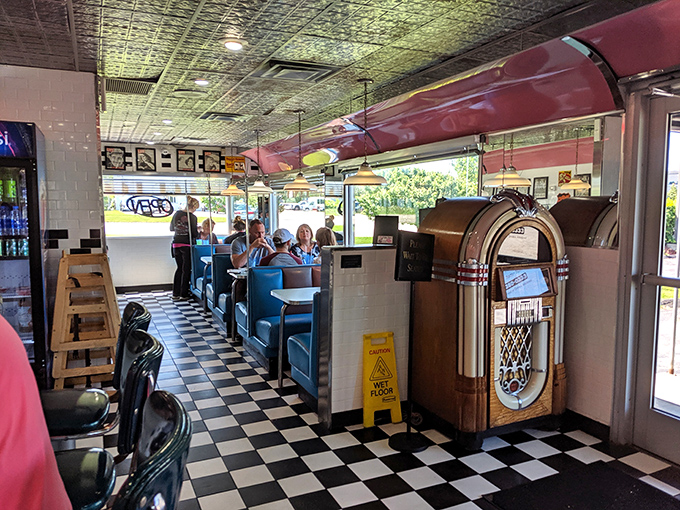 The classic diner layout—where strangers become friends over coffee, and the jukebox stands ready to provide the soundtrack to your meal.