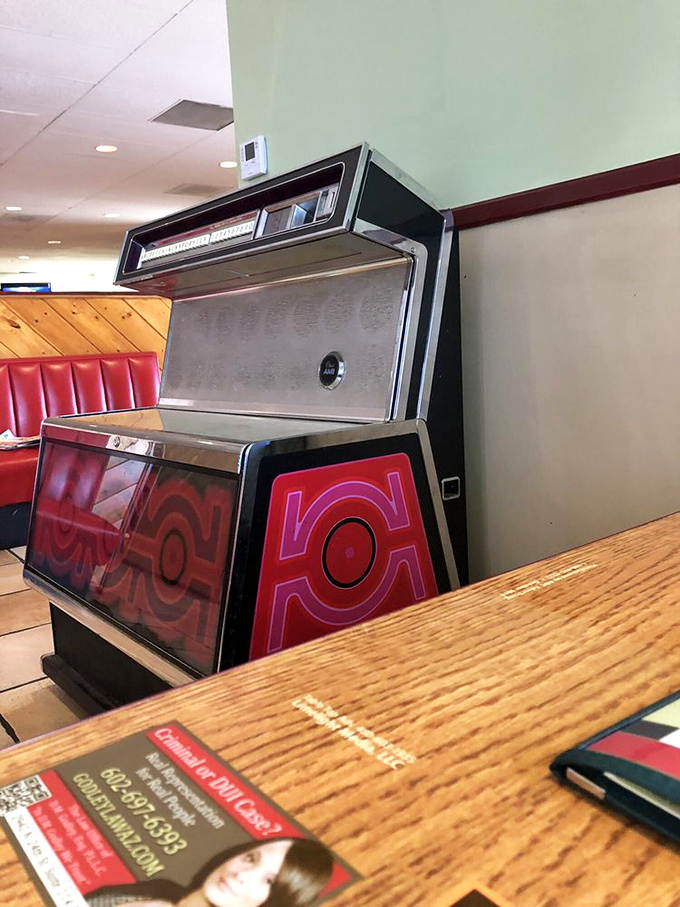 The jukebox—a time machine disguised as a music box, ready to transport you to simpler times with the press of a button.