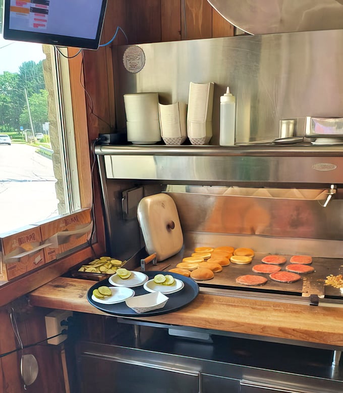 Where the magic happens – patties hitting the flat-top with that satisfying sizzle that promises deliciousness is just minutes away.