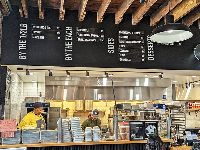 Where the magic happens – the open kitchen layout lets you witness the choreographed dance of smoke, meat, and fire.