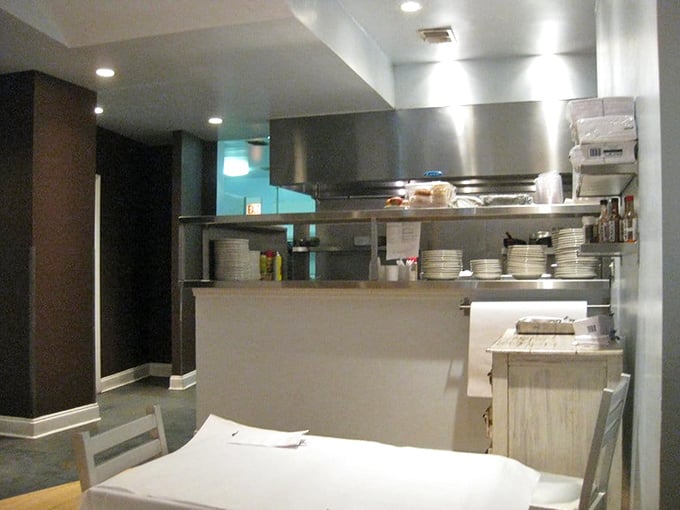 The kitchen—where breakfast dreams are born and pancake prayers are answered. Stainless steel never looked so promising.