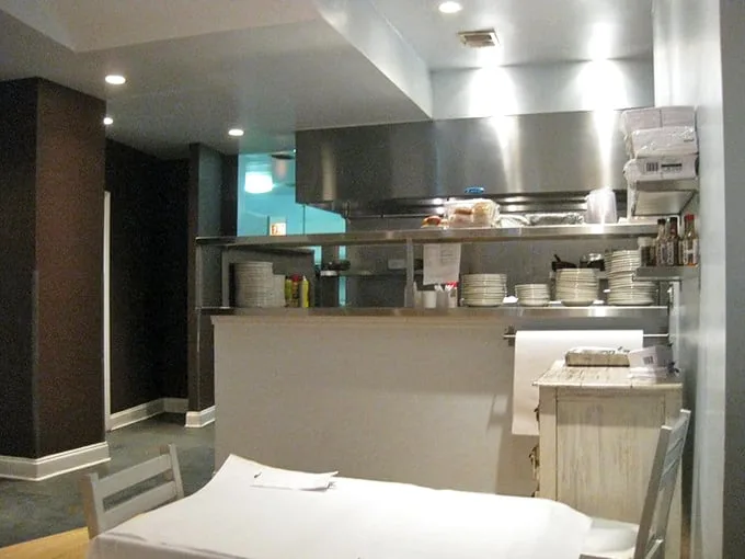 The kitchen—where breakfast dreams are born and pancake prayers are answered. Stainless steel never looked so promising.