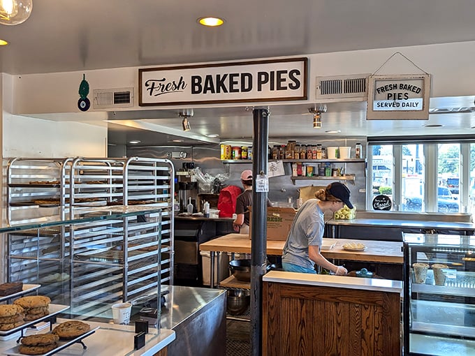The open kitchen isn't just for show—it's theater where flour, butter, and sugar perform daily miracles under skilled hands.