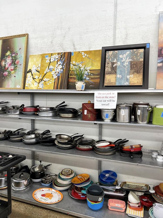 The kitchenware section – where cast iron pans with decades of seasoning wait alongside forgotten wedding registry items still sporting original stickers.