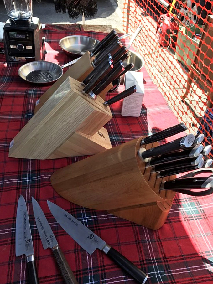 Chef-worthy knife sets displayed on classic plaid. These blades have stories to tell—and many more meals to prepare in their second-chance kitchens.