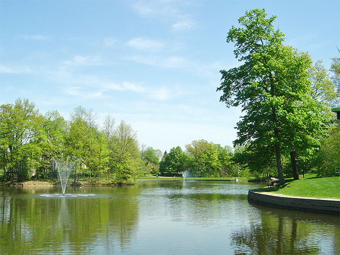 This peaceful park pond, complete with fountains, creates the perfect backdrop for contemplating life's big questions or just feeding very lucky ducks.