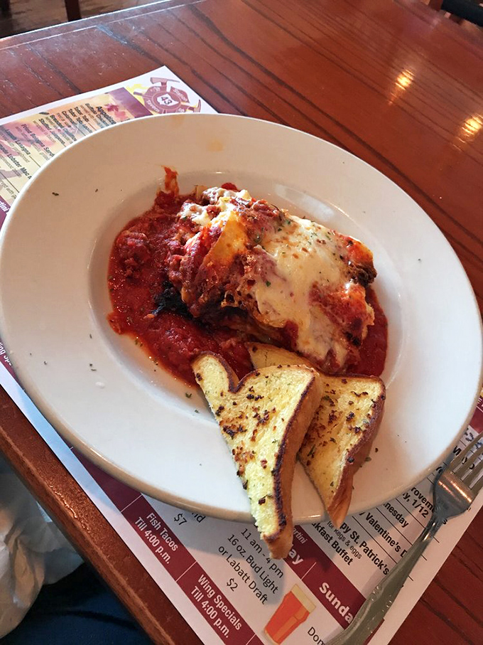 This isn't just lasagna—it's layers of comfort and tradition, where the cheese pull should be measured in feet, not inches.