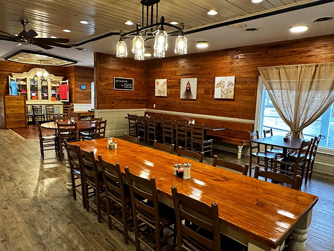 That long communal table isn't just furniture – it's an invitation to make new friends over plates of Southern comfort food.