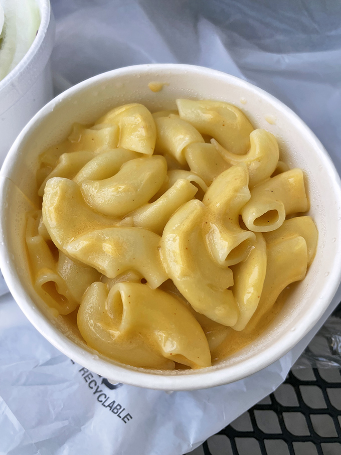 Mac and cheese that's achieved the perfect consistency—neither soup nor brick, but creamy, cheesy perfection. Comfort food that complements the smokehouse stars.