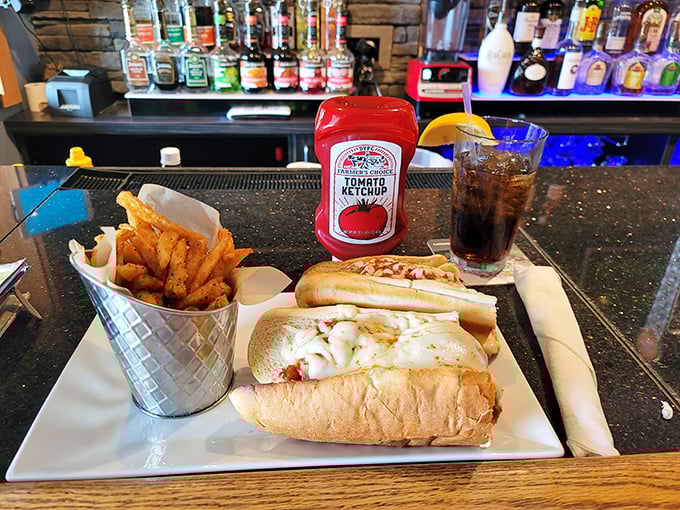 The legendary meatball sub in its natural habitat. That metal basket of fries isn't just a side – it's a supporting actor deserving its own award.