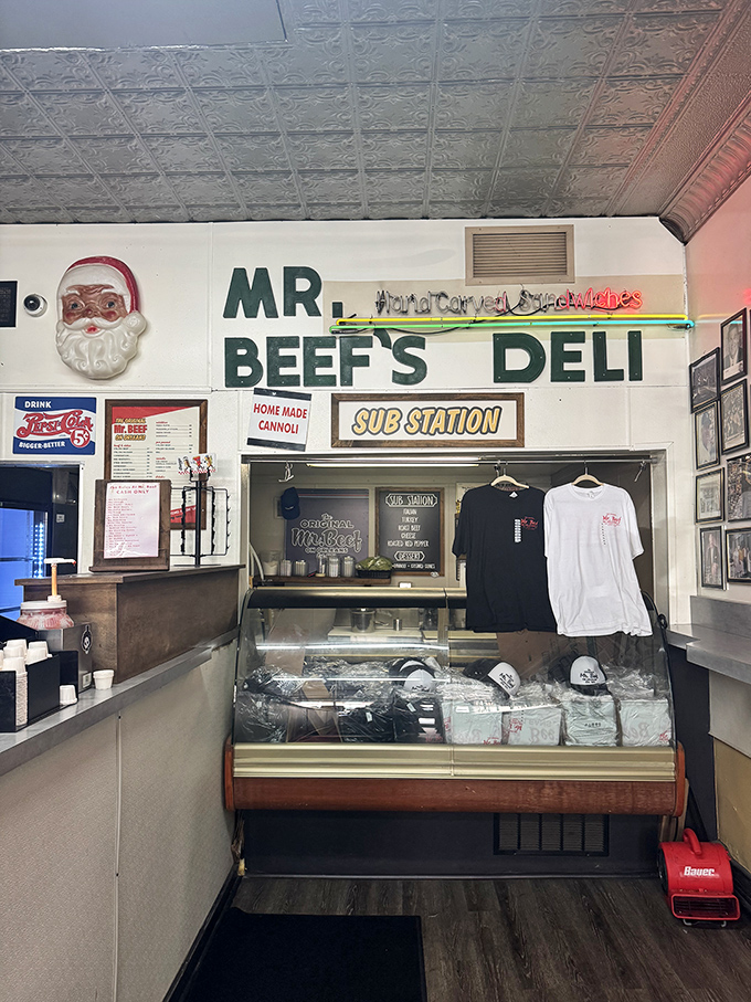 The merch counter proves Mr. Beef isn't just a restaurant—it's a lifestyle, complete with t-shirts to proclaim your allegiance.
