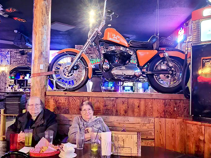 A vintage motorcycle watches over diners like a mechanical guardian angel. In Wisconsin, roadhouse decor isn't just decoration—it's cultural heritage.