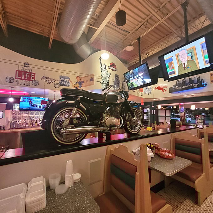 That motorcycle isn't just decoration—it's inspiration to hit the open road after you've hit the open-faced sandwiches. American icons celebrating American appetites.