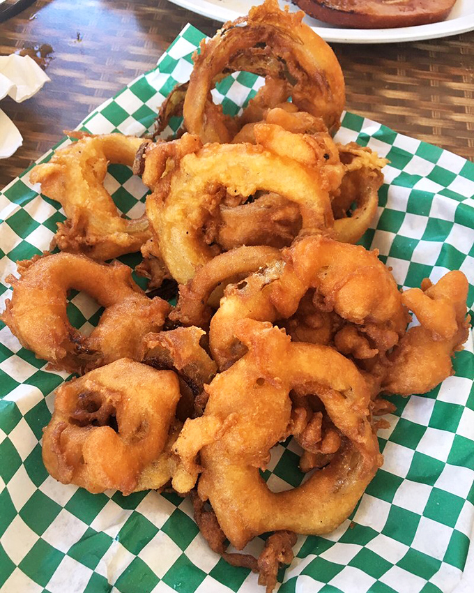 These aren't just onion rings – they're golden halos of crispy, battered perfection that make you question your loyalty to french fries.