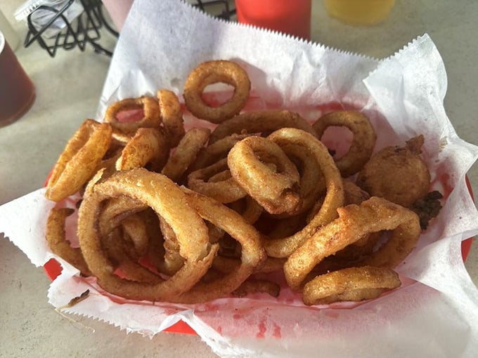 Golden halos of happiness. These onion rings aren't just sides—they're crispy, addictive main attractions in their own right.