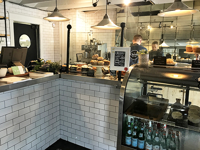 Where pastries and beverages begin their journey to your table—a gleaming subway-tiled command center of morning delights.